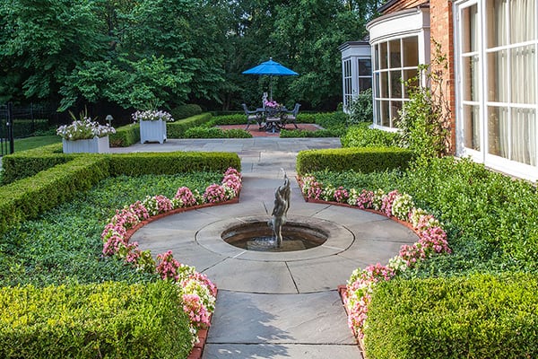 Winnetka Bluestone Patio Draws Focus to a Garden Fountain - Van Zelst
